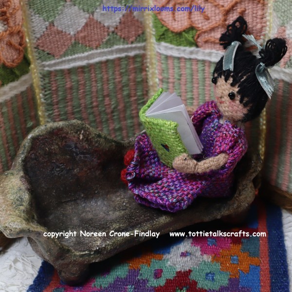 A tiny little book with a woven cover for the Lily Doll project ...